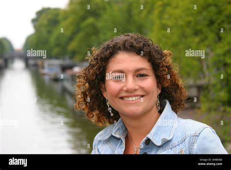 Pretty Tunisian Girl With Amsterdam Canals In The Background Stock