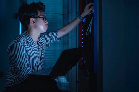 Premium Photo Computer Engineer Is Setting Up Network In Server