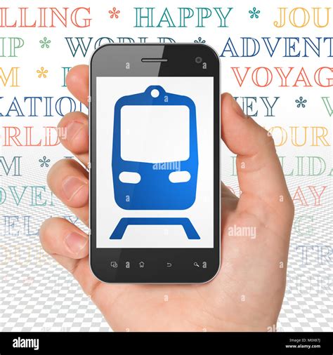 vacation concept hand holding smartphone with train on display stock