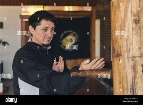 Man Practicing Traditional Wing Chun Kung Fu Training With The Wooden