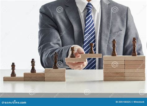 Businessman In A Suit Bridging The Gap Between Corporate Hierarchy
