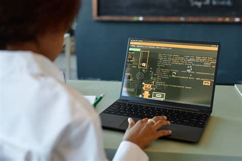 Over Shoulder Of Girl Using Laptop With It Code Lines On Screen Stock Image Image Of Online