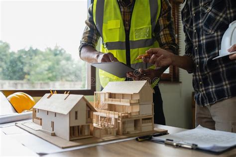Architect Team Working With Blueprints For Architectural Plan Engineer