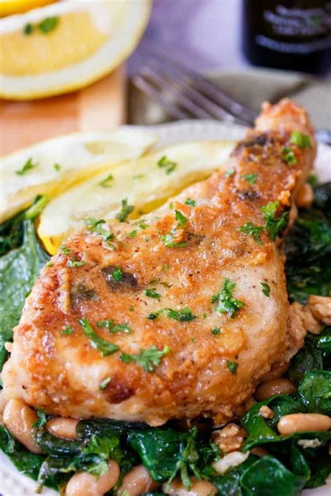 Pan Fried Pork Chops In White Wine Sauce With Spinach And Beans The