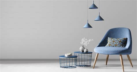 회색 벽 위에 커피 테이블 램프 파란색 안락의자가 있는 거실 내부 홈 디자인 3d 렌더링 사진 Unsplash의 집 이미지