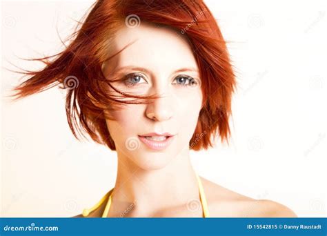 Sexy Redhead Woman In Cosplay Costume Of Warrior Cat With Swords