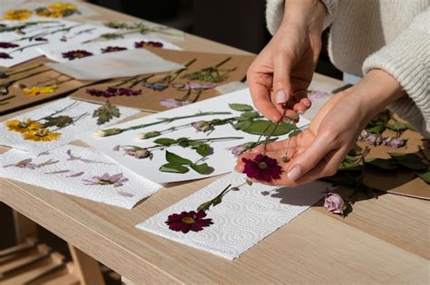 Free Photo View Of Female Artisan Pressing Flowers