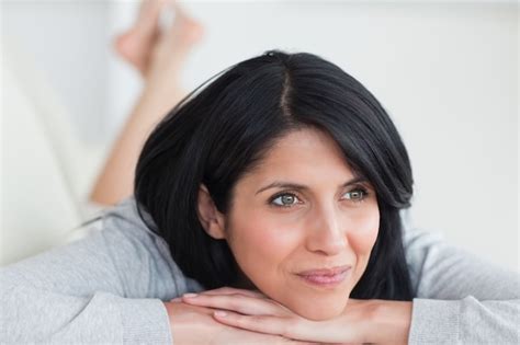 Premium Photo Smiling Woman Laying On A Couch