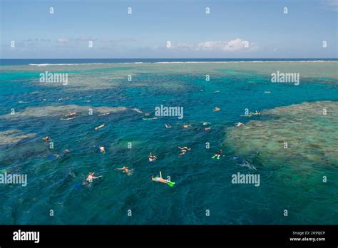 People Are Enjoying Swimming And Snorkeling In Beautiful Turquoise