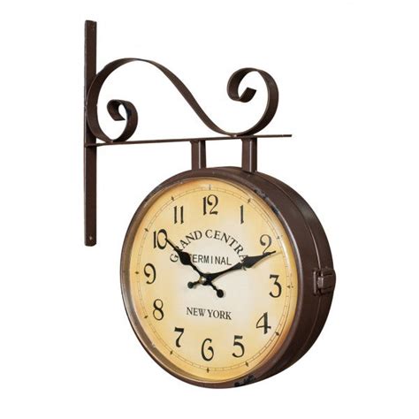 Horloge double face murale type station en fer forgé finition blanche antique L32XPR10xH43 cm