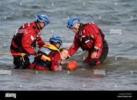 Coastguard Rescue Carry A Person From The Sea Coastguards Rescue Rnli