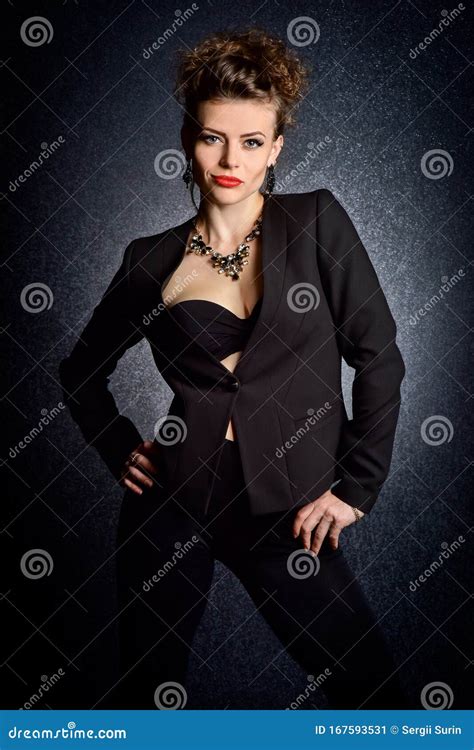 Beautiful Woman With A Necklace On Her Neck Poses In A Jacket Visible