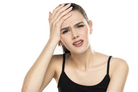 Frustrated Brunette Teen Girl Holding Hand On Forehead Stock Image