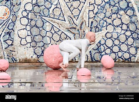 Young Hairless Girl Ballerina With Alopecia In White Futuristic Suit