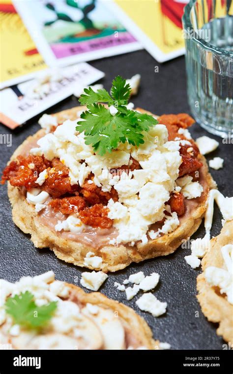 Sope a traditional Mexican dish with bean purée chorizo cheese sour