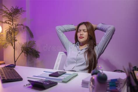A Female Supervisor Is Working Overtime At The Company Stressed Because