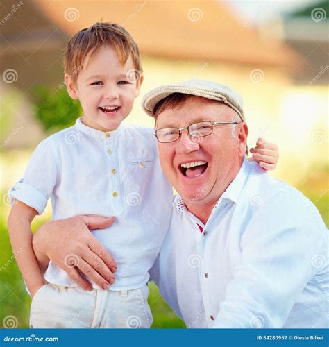 Portrait Of Happy Grandpa And Grandson Outdoors Stock Image Image Of