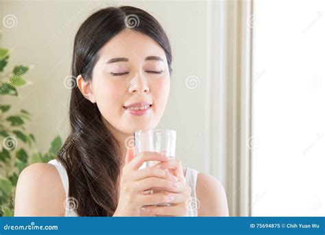 Asian Woman Enjoy The Freshness Of Clean Water From Perfect Environment