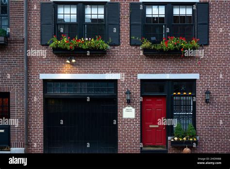 View Of An Entrance To An Apartment Building Red Door With Windows