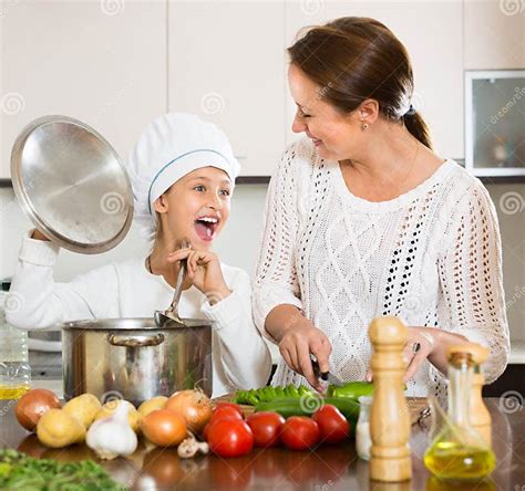 Mother And Daughter Cooking Together Stock Image Image Of Assistant