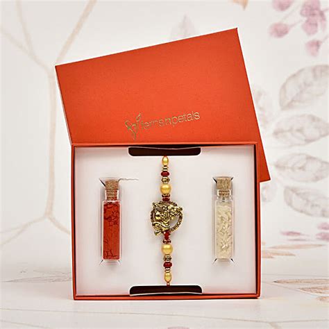 Bright Golden And Red Rakhi For Brother Bahrain T Bright Golden