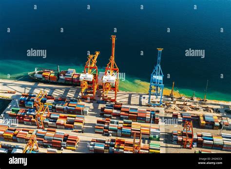 Aerial View Of Containers Loading And Unloading To The Ship In The Sea Port Logistic And