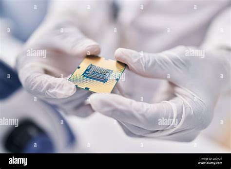 African American Woman Wearing Scientist Uniform Holding Cpu Microchip