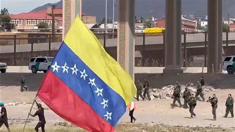 Illegal Migrants Wave Venezuelan Flag After Crossing Us Southern Border