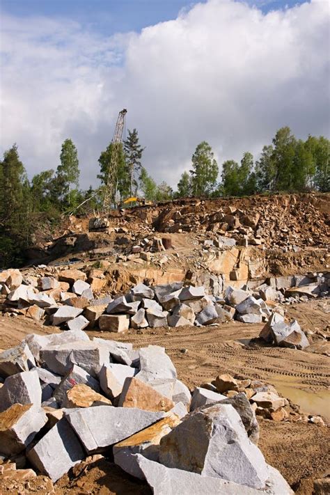 Granite Mining Wheel Loader Loading Ore Into Dump Truck At Opencast