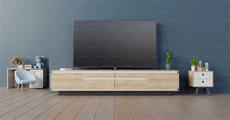 캐비닛 인테리어의 Tv 디자인 식물 선반 진한 파란색 벽에 램프 3d 렌더링이 있는 현대적인 객실 사진 Unsplash