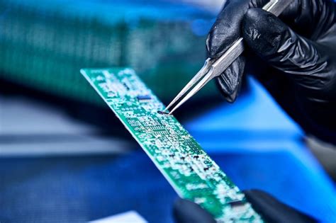 Premium Photo Engineer Factory Worker Electronics Works With A Chip