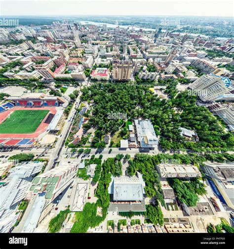 Aerial City View With Crossroads And Roads Houses Buildings Parks