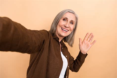 Photo Of Pretty Positive Lady Toothy Smile Take Selfie Arm Palm Waving
