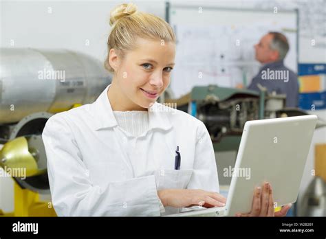 Female Engineer Holding Laptop In Aviation Design Room Stock Photo Alamy