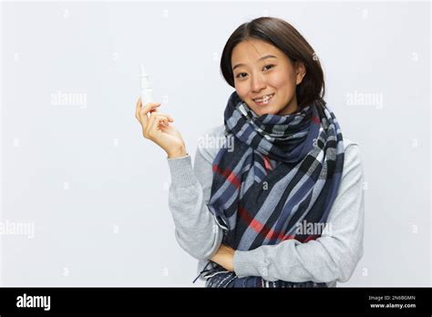 Happy Asian Woman Sickness Spray Nasal Spray For Allergies And Colds