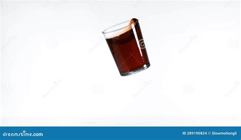 Glass Falling And Red Wine Splashing Against White Background Stock