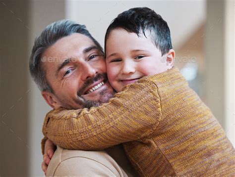 A Fathers Love Is Irreplaceable Shot Of A Father Hugging His Son