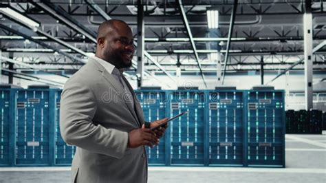 Cheerful Server Room Engineer Troubleshooting Backend Operations Using Tablet Stock Video