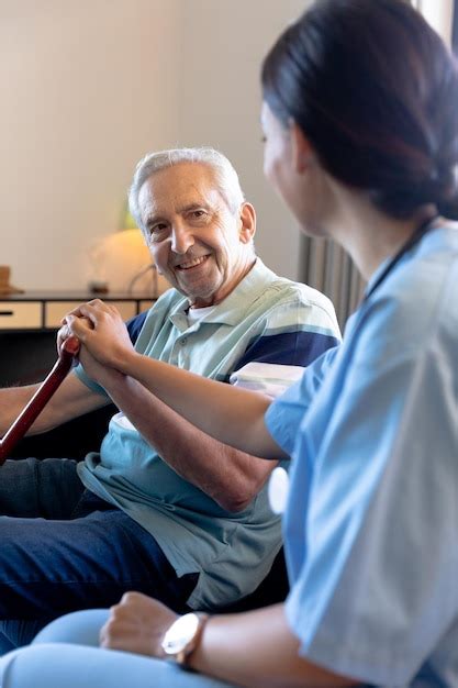 Premium Photo Biracial Female Physiotherapist Consoling Caucasian