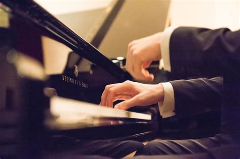 Premium Photo Midsection Of Man Playing Piano