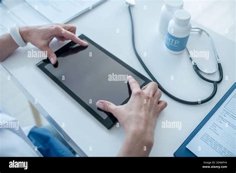 Human Hands Touching Sensor Screen On A Tablet Stock Photo Alamy