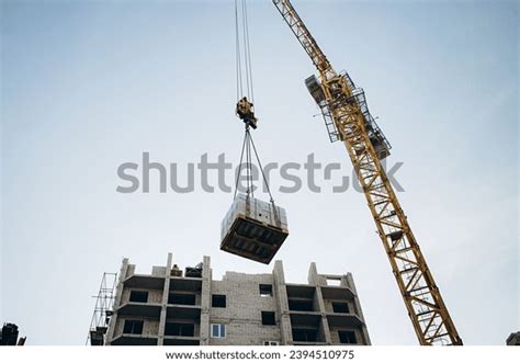 Crane Lifts Bricks Height Construction High Rise Stock Photo 2394510975