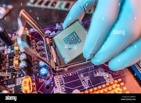Engineer Repairman Holding Hands In Black Gloves Chip Processor Cpu To
