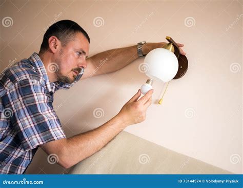 Man Installing Bulb Stock Photo Image Of Holding Installing