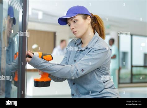 Female Worker Using A Cordless Screwdriver Stock Photo Alamy