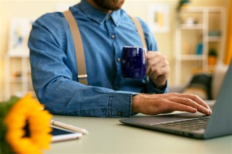 Free Photo Portrait Of Bearded Man Working On Laptop