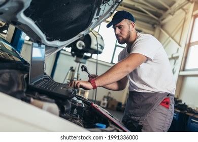 Professional Car Mechanic Working Auto Repair Stock Photo 1991336000 | Shutterstock