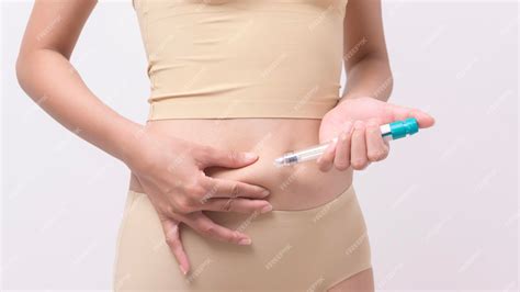 Premium Photo Close Up Woman Using Ivf Treatment Injection On Belly