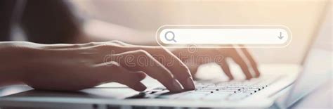 A Closeup Image Showing A Hand Typing On A Laptop Keyboard With A