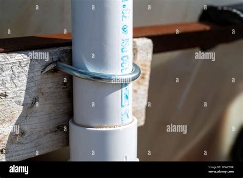 Vertical Installation Of A Pvc Pipe In An Agricultural Setting Showing